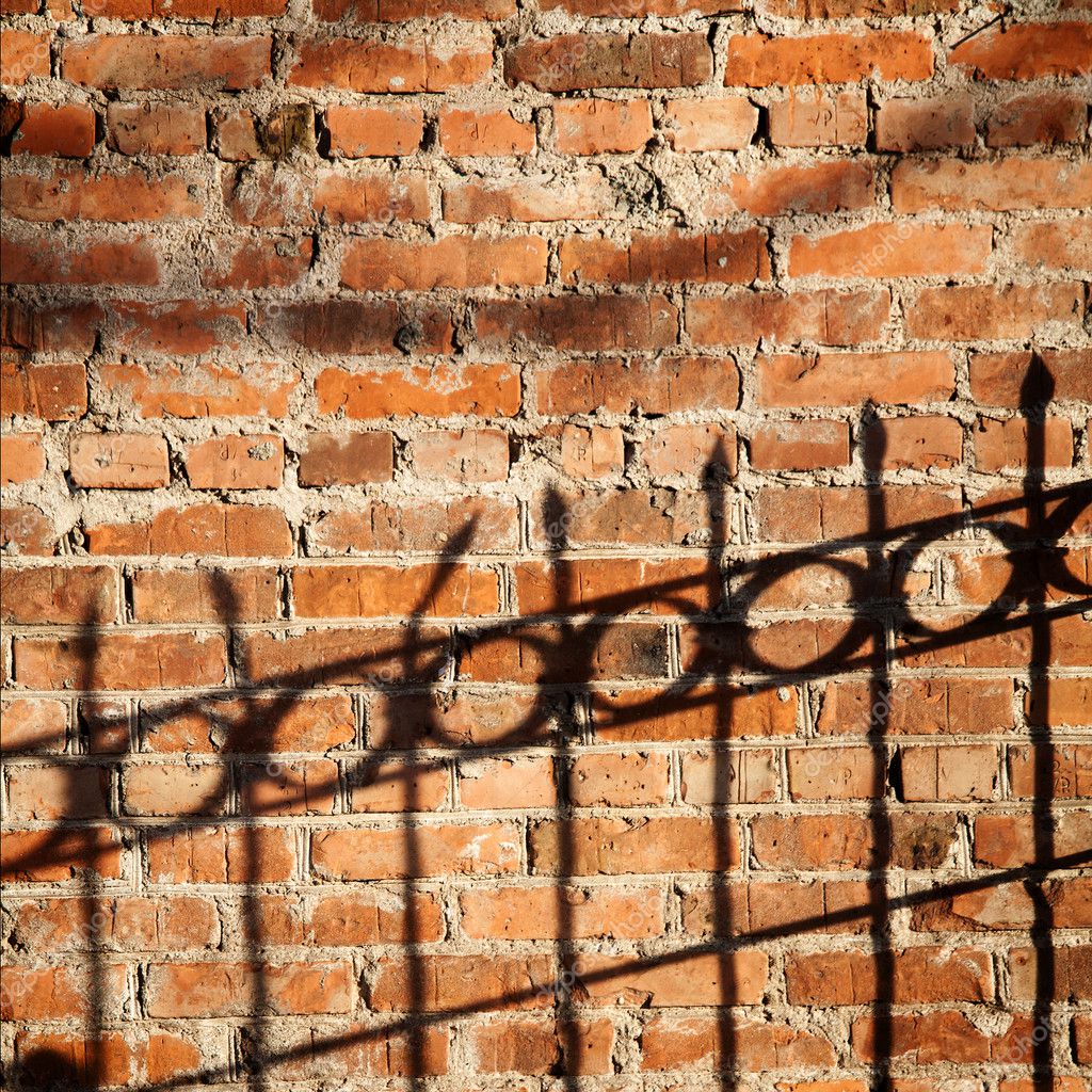 Shadow of a fence on a brick wall — Stock Photo © Taigi #8272388