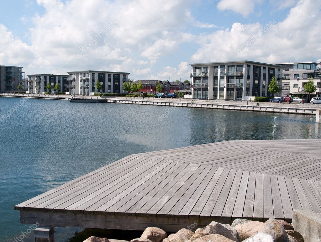 Modern seaside waterfront apartments building — Stock Photo © ronyzmbow ...