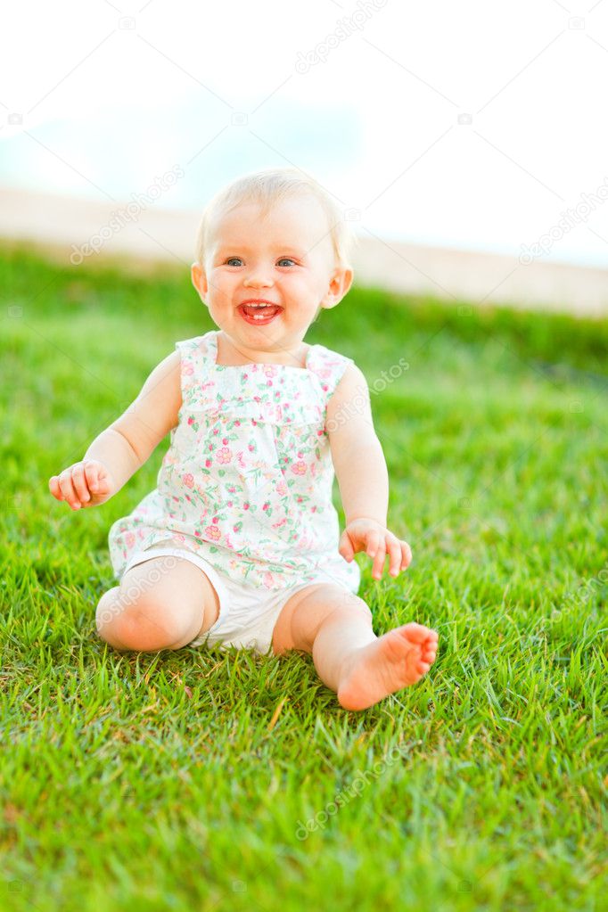 Happy baby playing on grass — Stock Photo © CITAlliance #9001151