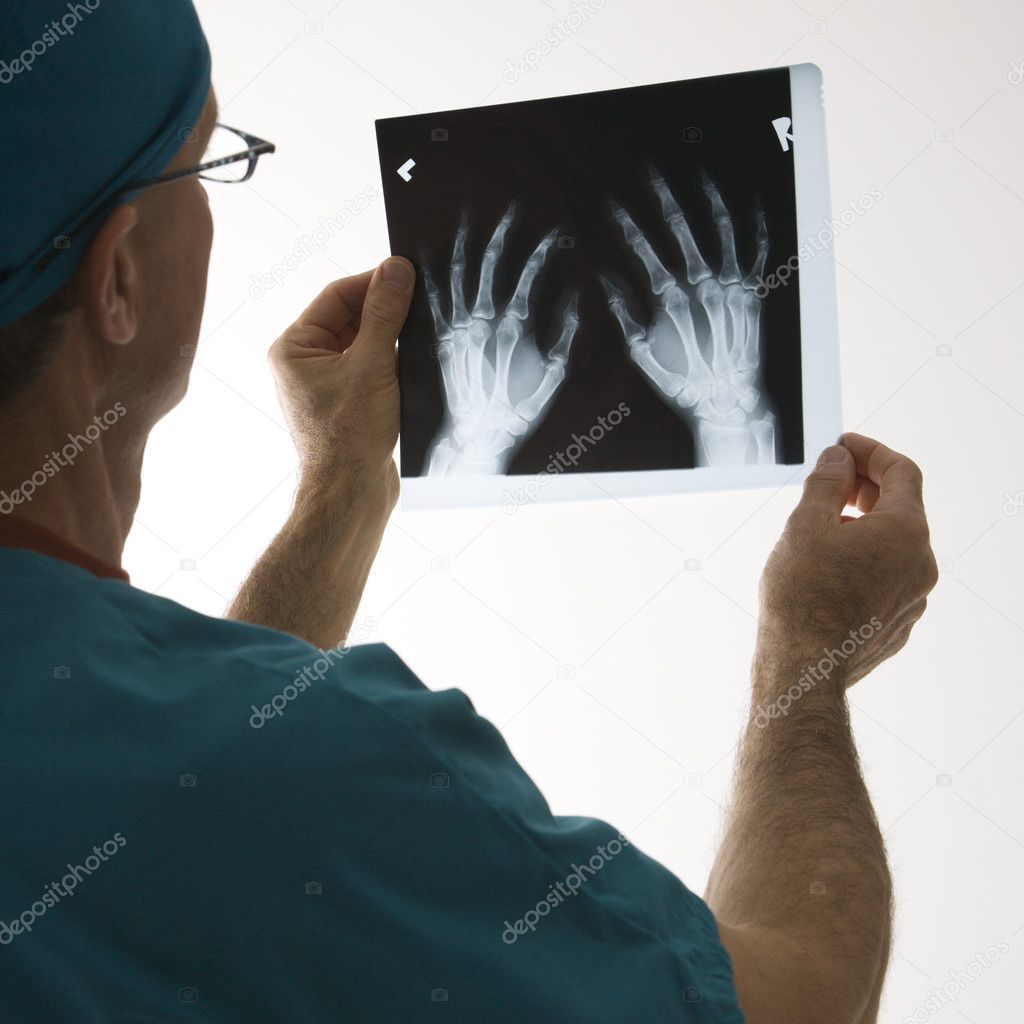 Doctor holding an x-ray. Stock Photo by ©iofoto 9523073