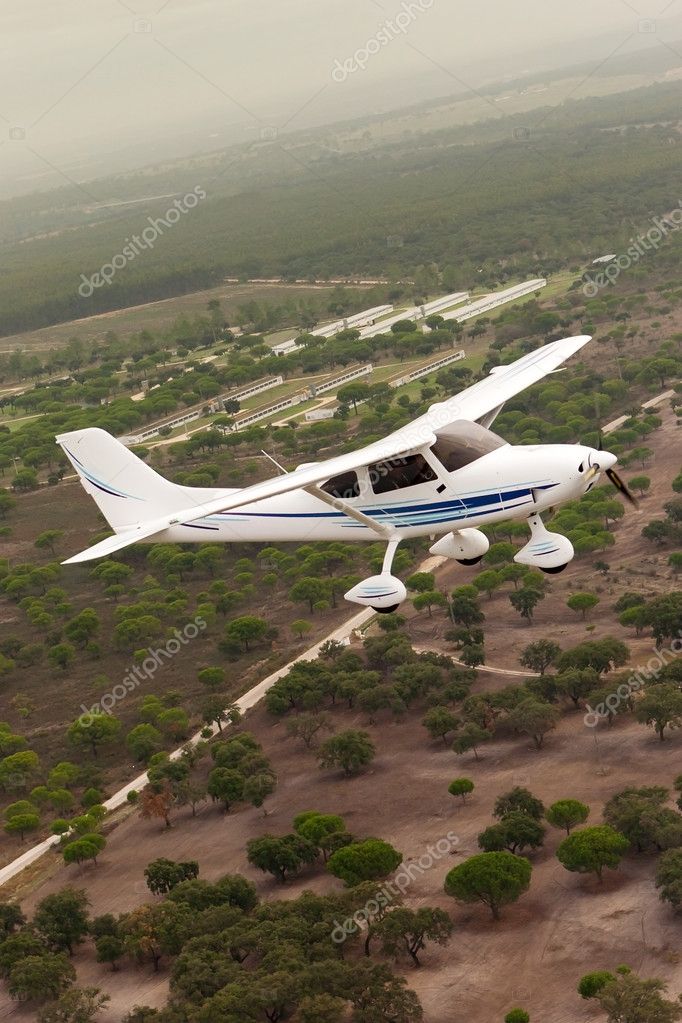 Small airplane flying Stock Photo by ©papandreos 9675974
