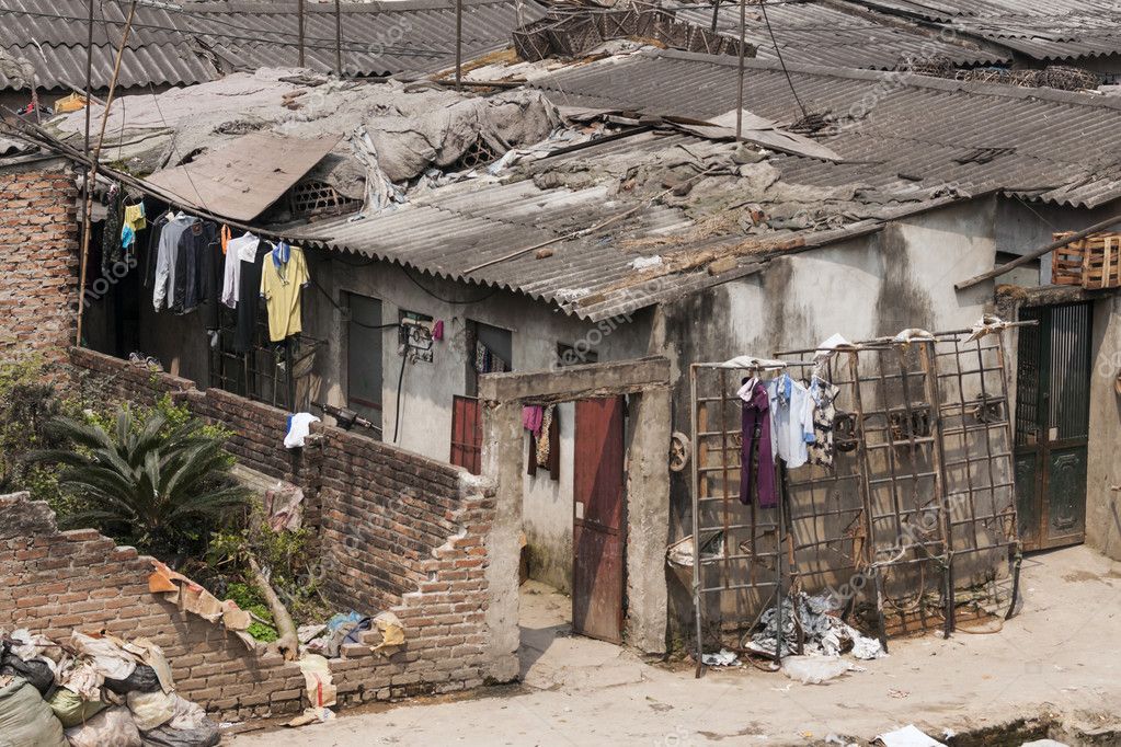 Poor housing in central Hanoi. — Stock Photo © Klodien #10731296