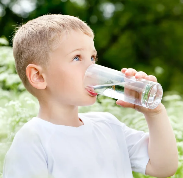 Child drinking pure water — Stock Photo © maxoidos #9484875