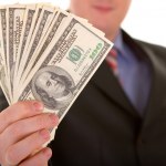 Business Man Displaying a Spread of Cash Stock Photo by ©Melpomene 28952811