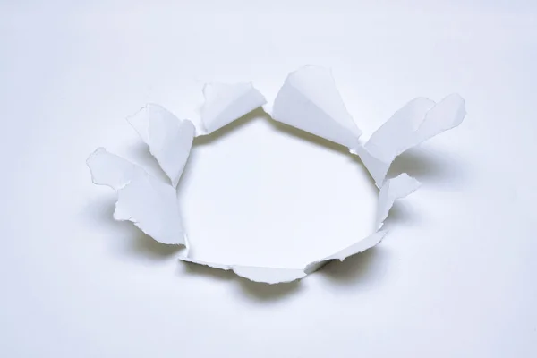 Torn hole through paper Stock Photo by ©SSilver 10838865