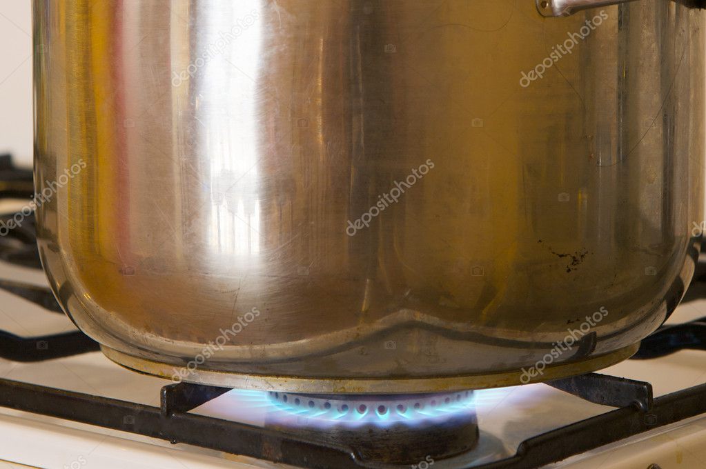 Photo of a pot on the flames of kitchen — Stock Photo © Gelpi #9438788