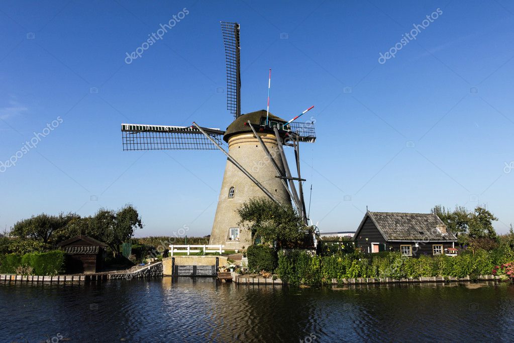 Old windmill with house Stock Photo by ©romantsubin 10283200