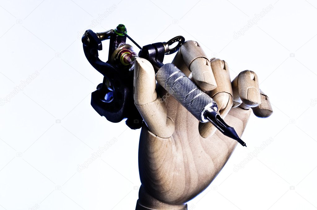 Tattoo machine hand 1 Stock Photo by ©tomhooliganov 10182942