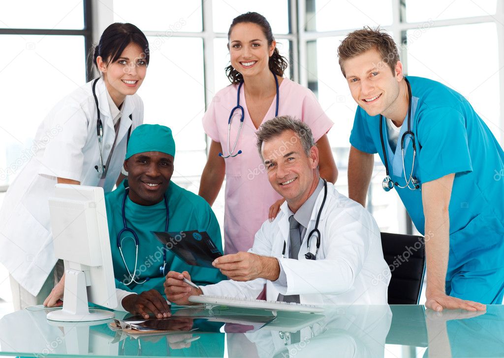 Group of doctors in a meeting Stock Photo by ©Wavebreakmedia 10312910