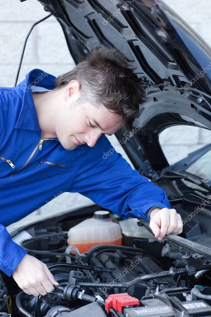 Concentrated man repairing a car — Stock Photo © Wavebreakmedia #10318439
