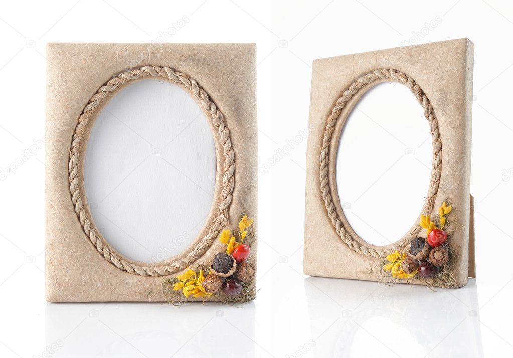 Vintage photo-frame on table Stock Photo by ©odua 10494746