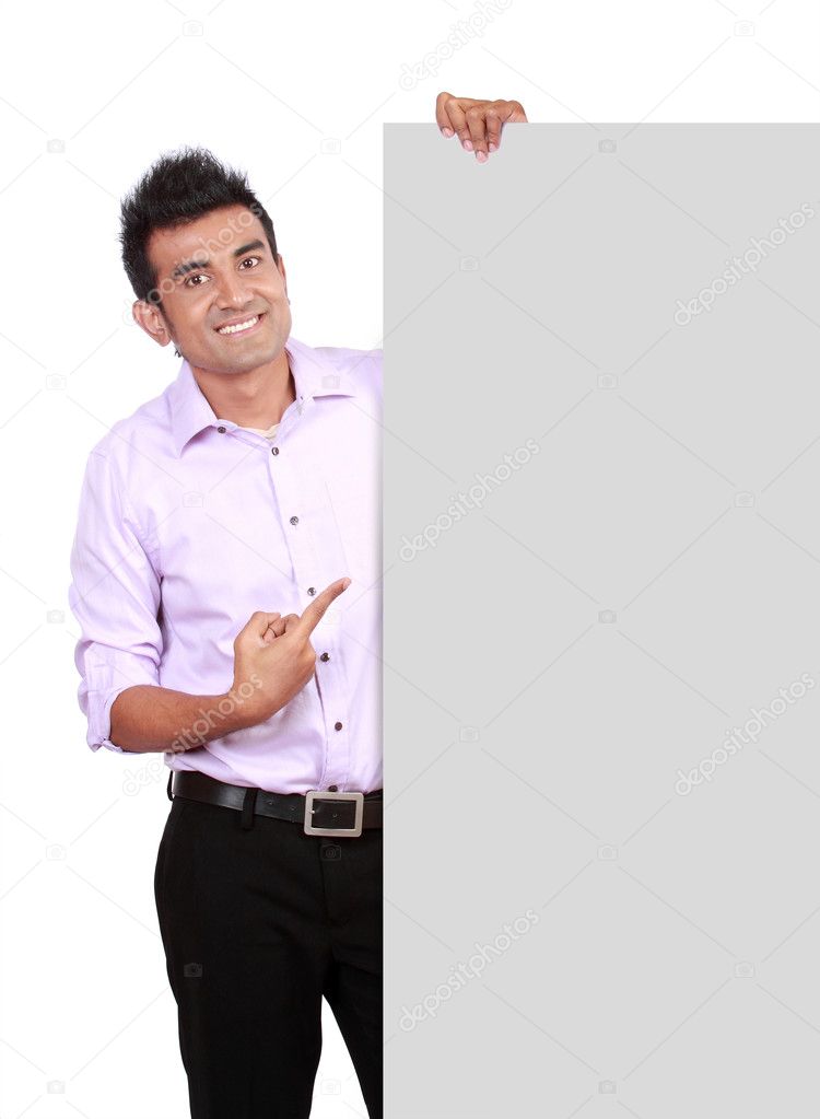 Man peeking behind empty white billboard — Stock Photo © odua #10637729