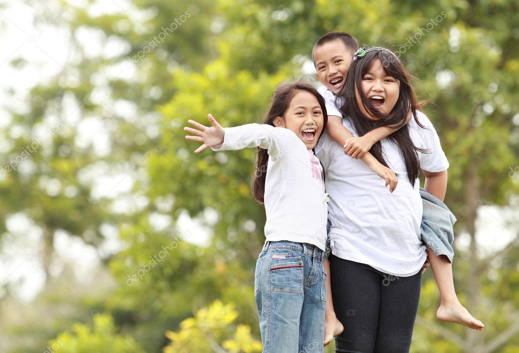 Happy kids laughing together Stock Photo by ©odua 10637923
