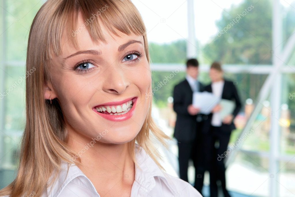 Face of successful business woman looking at camera with smile Stock ...