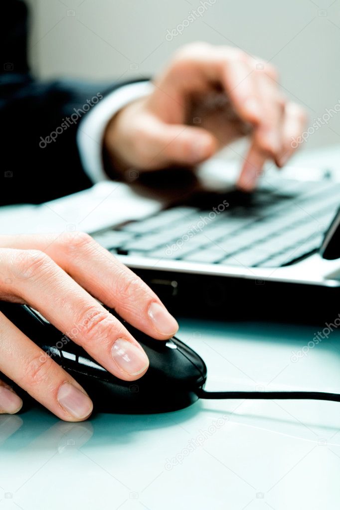 Hand with mouse Stock Photo by ©pressmaster 10717291
